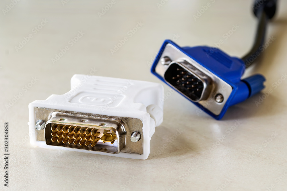 Dvi-d socket of white adapter for blue vga socket monitor cord behind ...