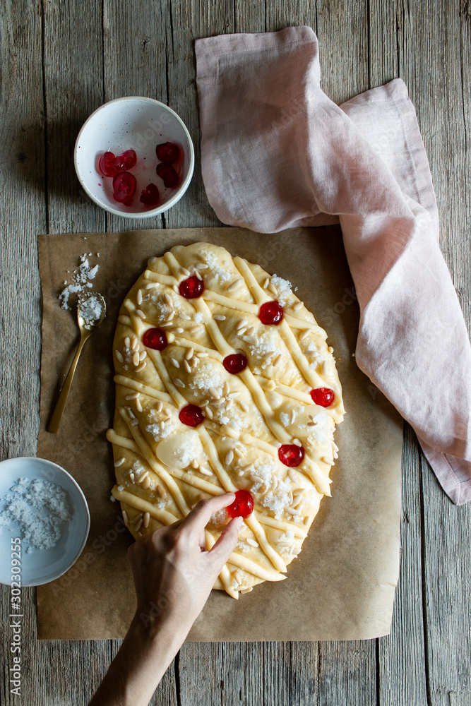 From above unrecognizable person decorating traditional Coca de San ...