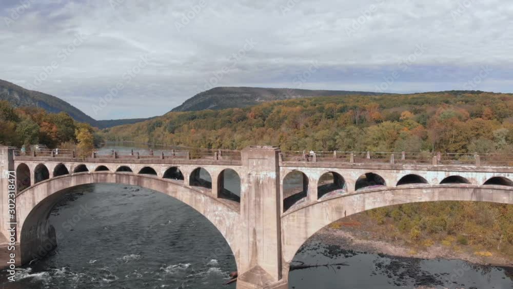 Scenic Pennsylvania countryside in autumn with concrete arched bridge ...