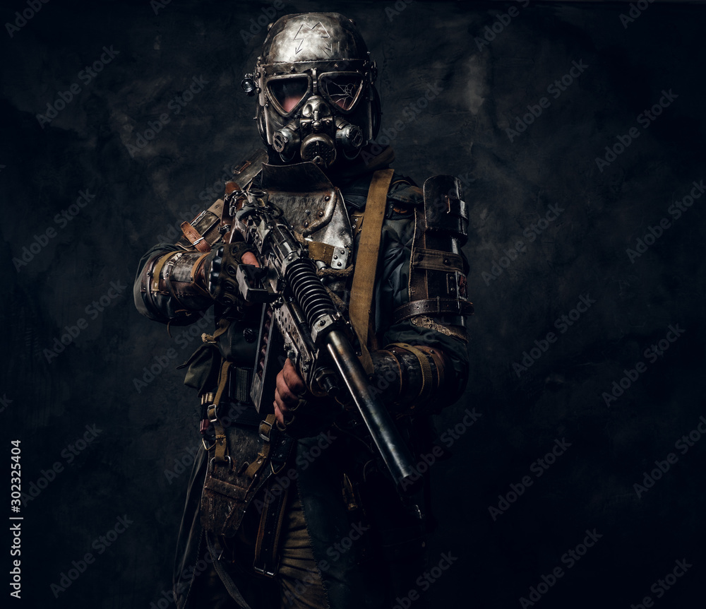 Cool cosplay costume of post - apocalypse knight, man is posing at dark ...
