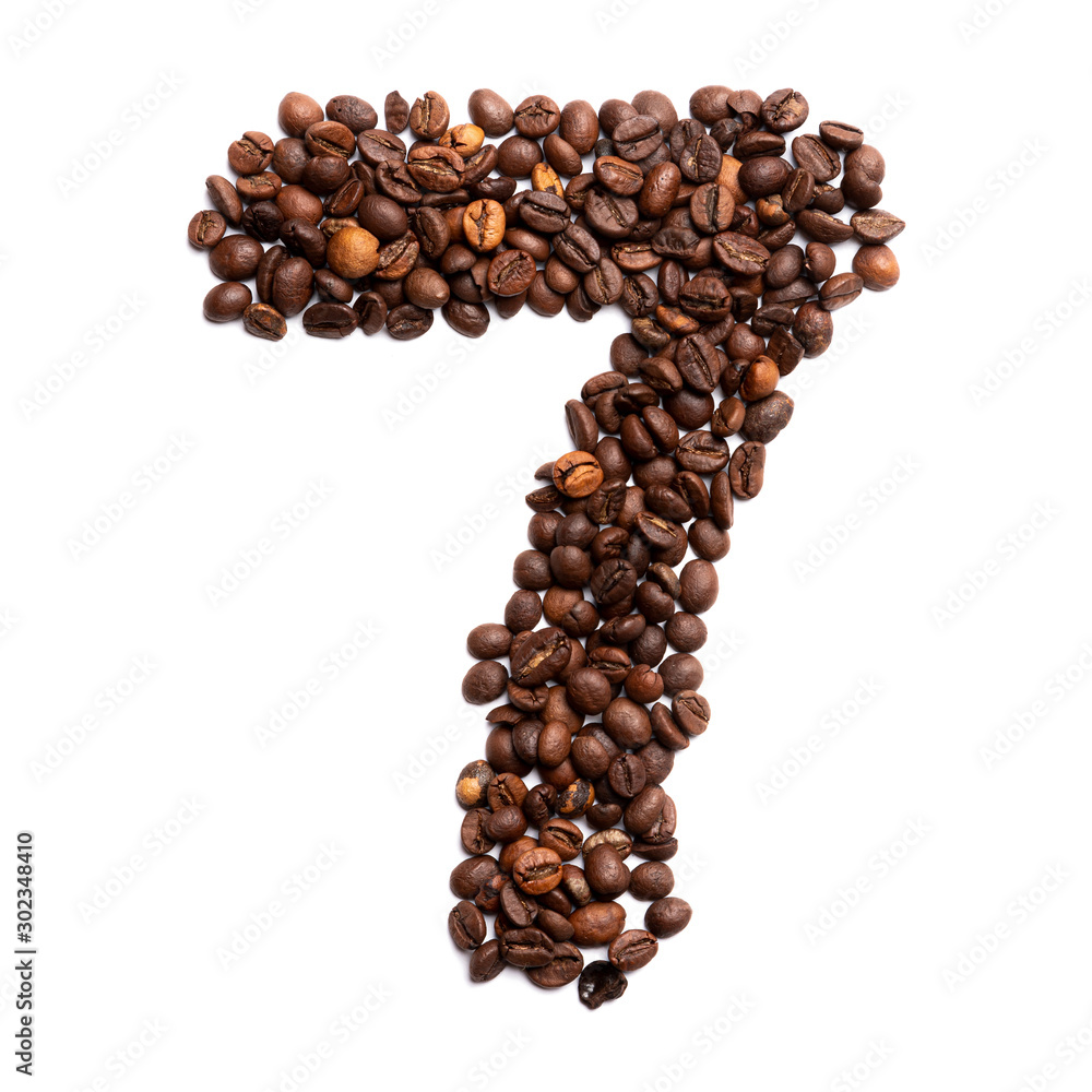 Arabic numeral "7" from freshly roasted cocoa beans on a white isolated ...