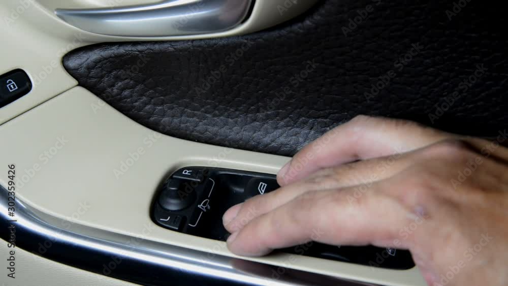 Car window opened by push down window switch by driver door control ...