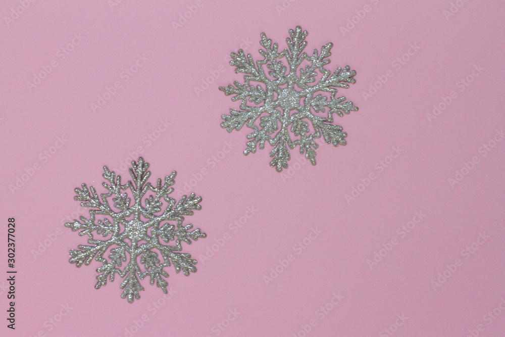silver snowflakes on a pink background. for postcards. new year and ...
