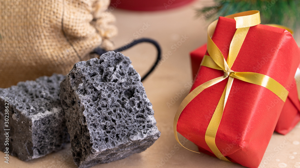 Carbon dulce or Sweet coal candy and red Christmas boxes, typical ...