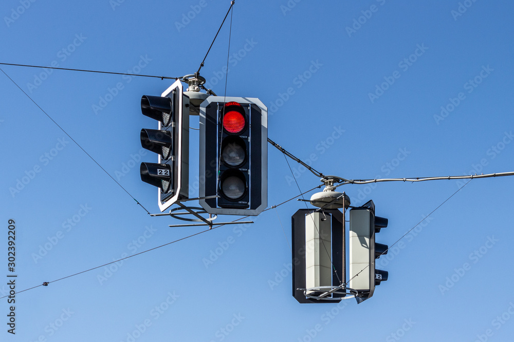 Red stop light on traffic light sign, hanging on wires. Stock Photo ...