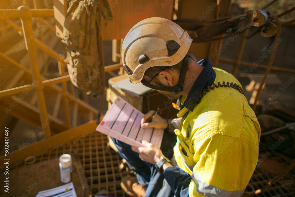 Top view of construction supervisor wearing a white safety head ...