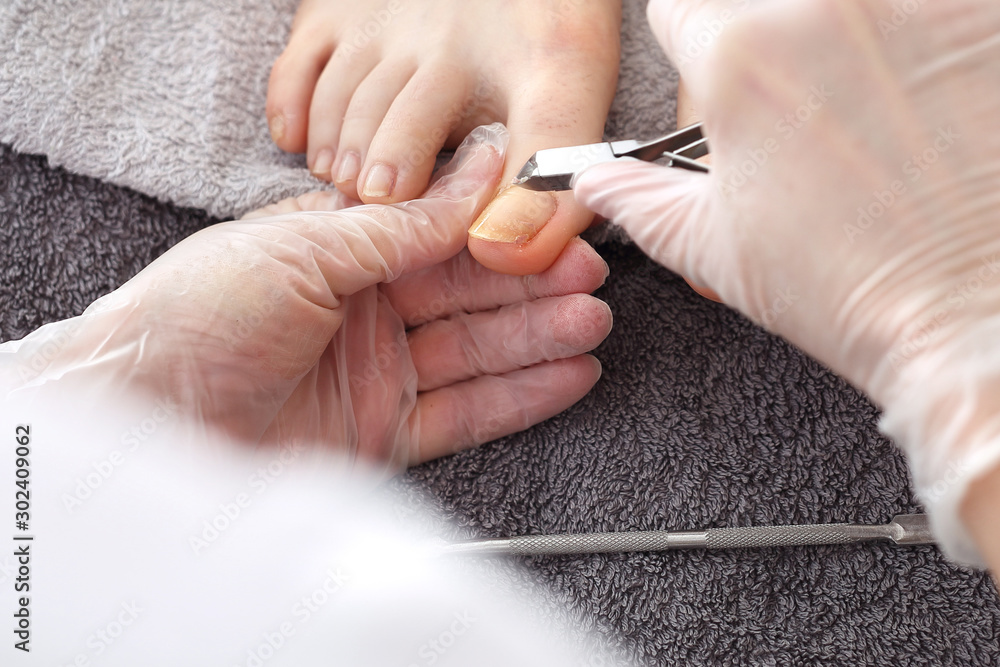 Foot care, female feet during a pedicure at a beauty salon The ...