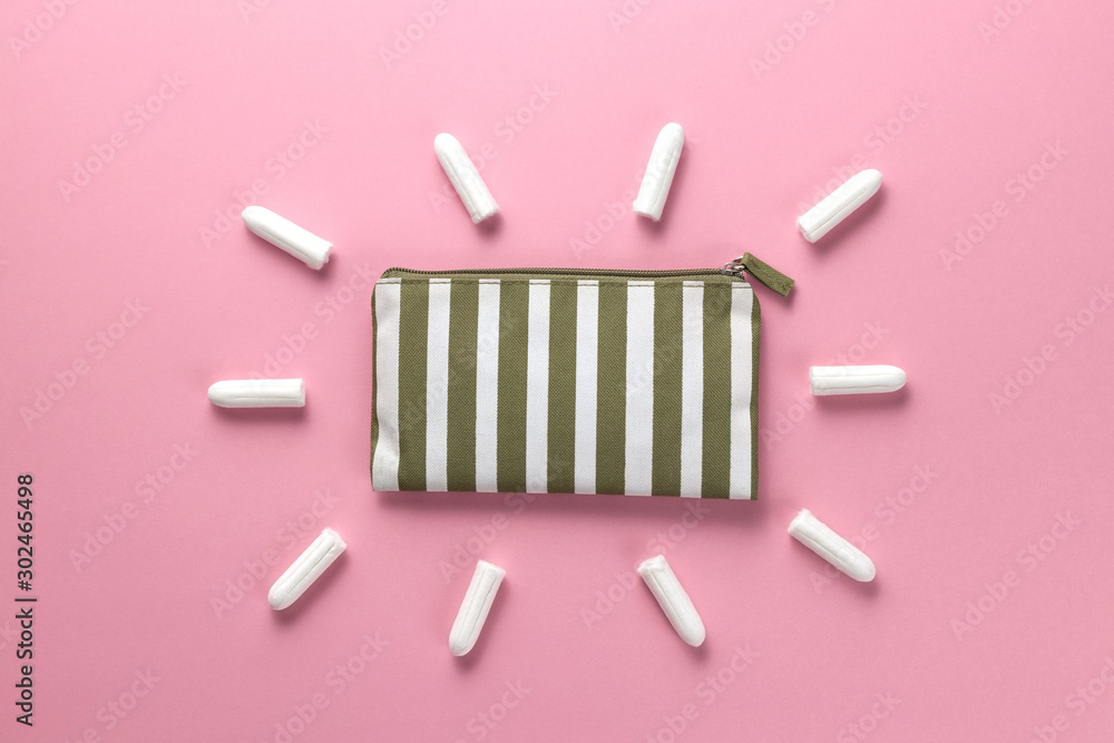 Tampons, feminine sanitary pads on a pink background. Hygienic care on ...