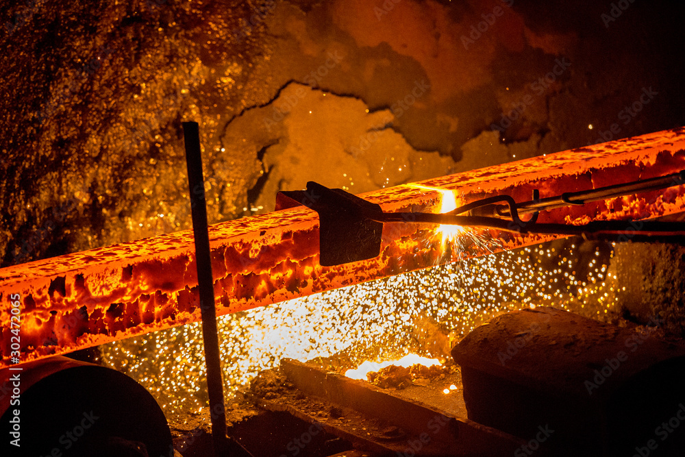 Gas cutting of the hot metal in steel plant at Demra, Dhaka, Bangladesh ...