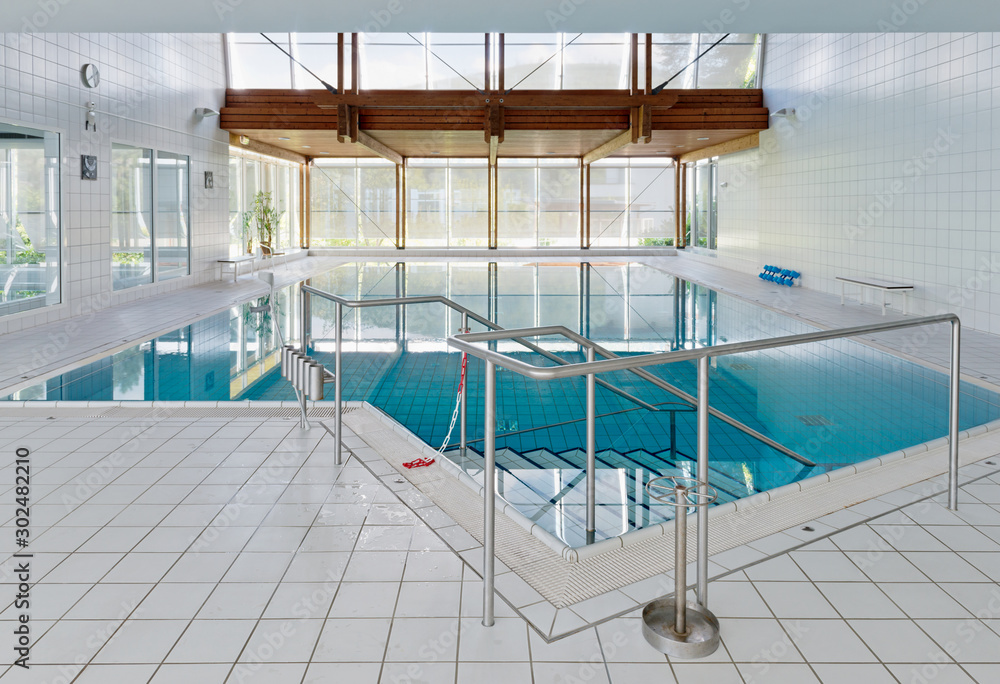 indoor pool with stairs and glass facade Stock Photo | Adobe Stock