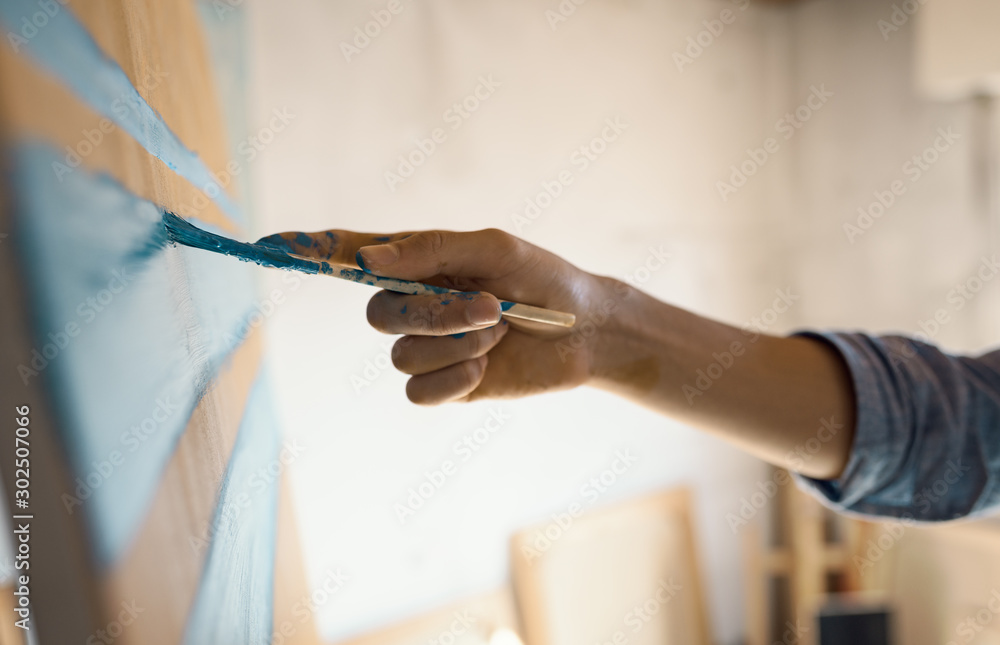 Artist creating an abstract artwork Stock Photo | Adobe Stock