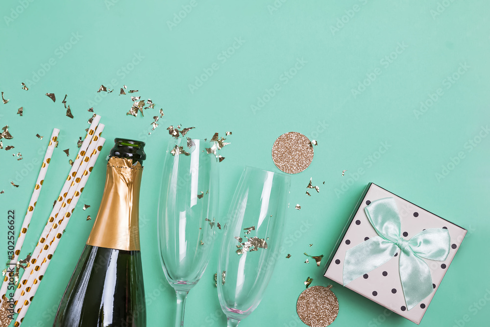 Bottle of a champagne, gift box, golden confetti and glasses. Stock ...