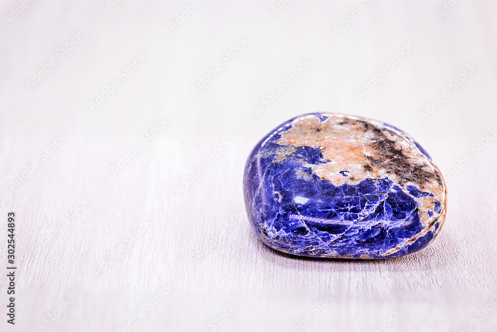 Mineral sample of brilliant blue faceted stone known as sodalite is a ...