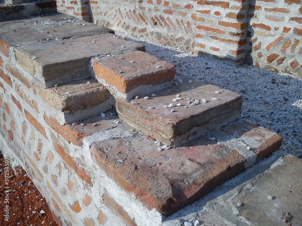 Old roman brick. The restored wall of the building of Roman times ...