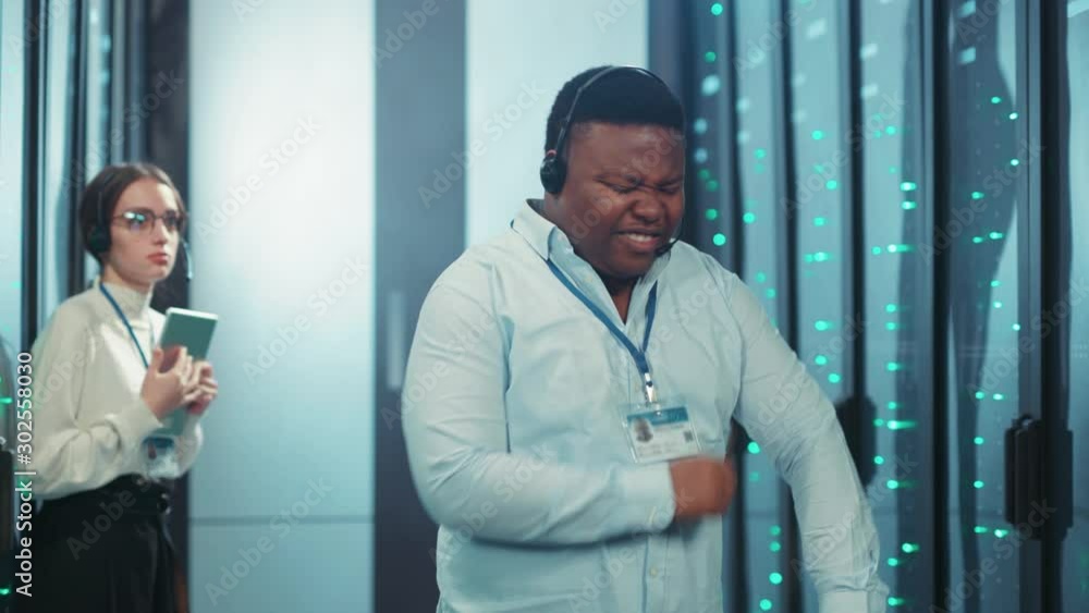 Aggressive black data center specialist arguing throwing notepad in ...