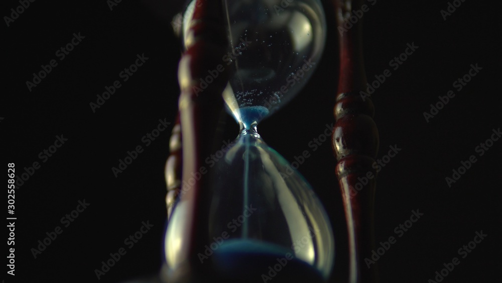 Sand timer clock with sand flowing countdown from through hour glass ...