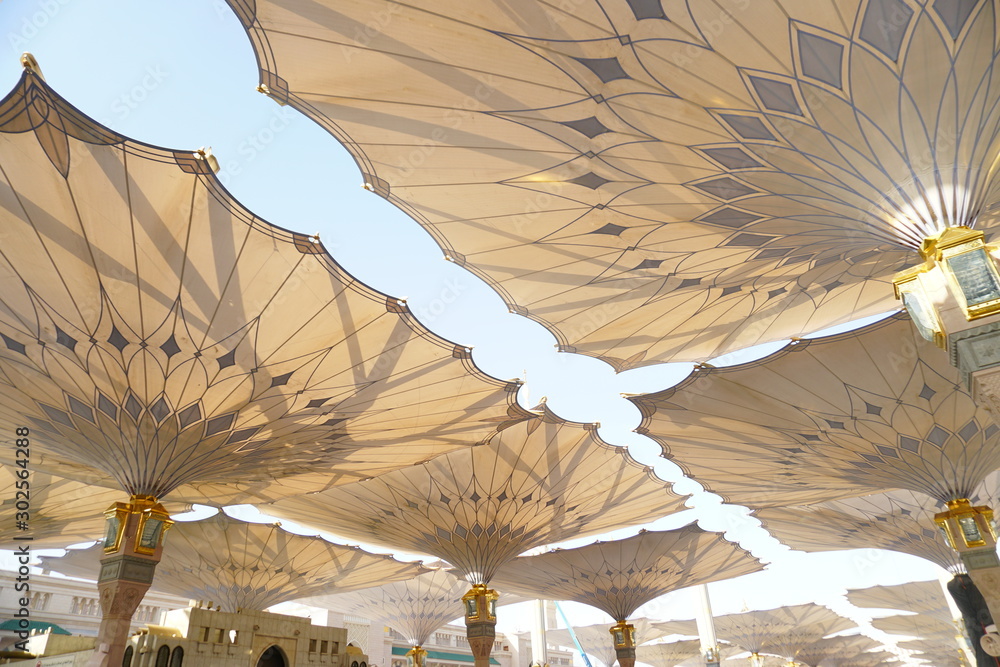 Big umbrella structure of al masjid al nabawi from the holy land and ...
