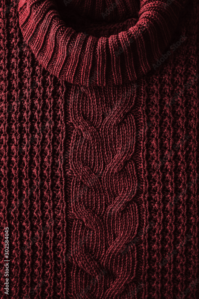 Knitted texture background of a winter red sweater with a high neck ...