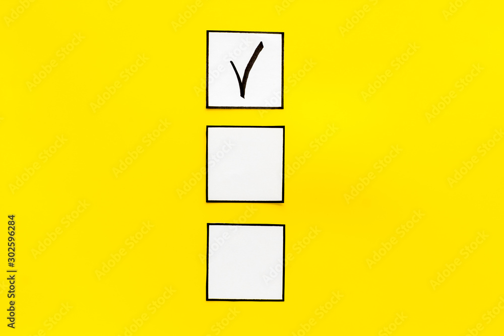 Check mark in check-box on yellow background top view copy space Stock ...