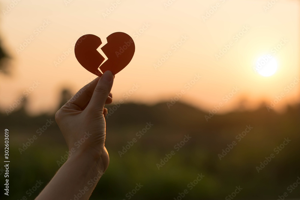 Hand Holding Broken Heart