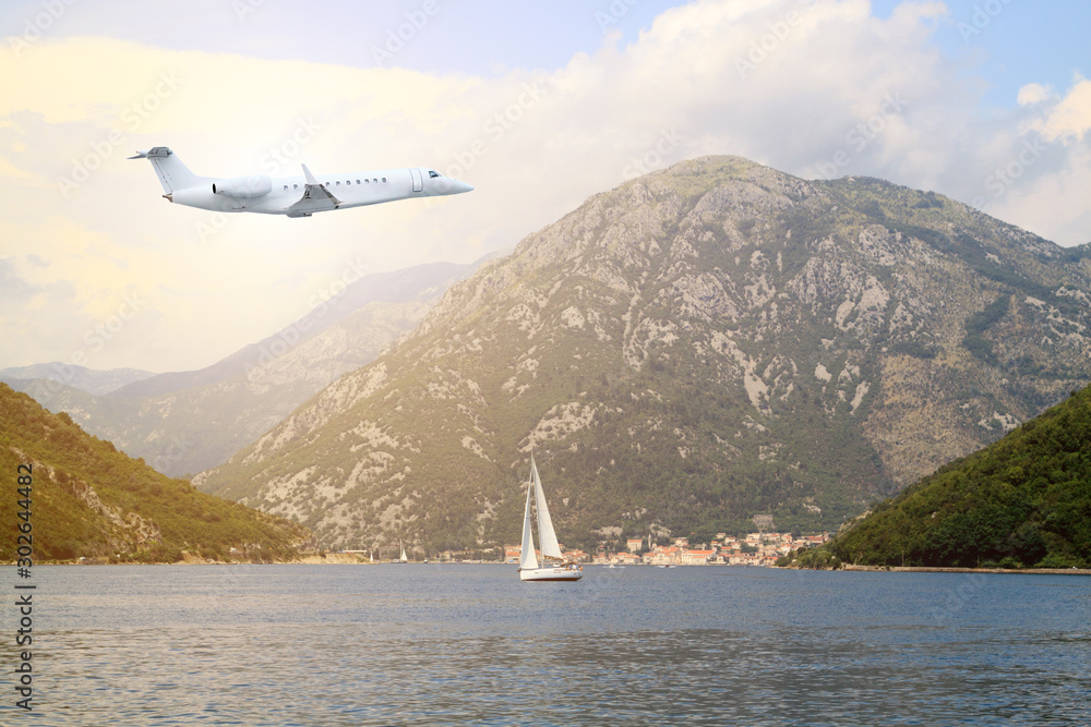 White private jet business jet flies against backdrop of beautiful ...