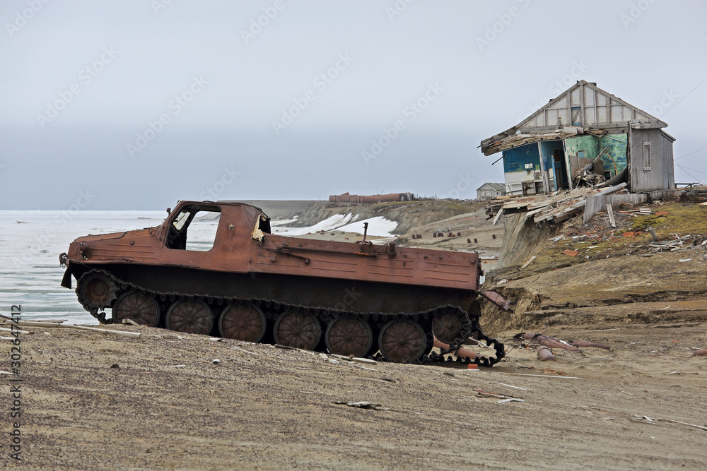 Amphibious vehicle and piles of scrap metal waste in the Arctic Stock ...