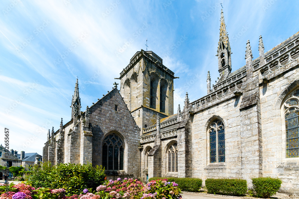 view of the historic and picturesque church of Saint Ronan in Locronan ...