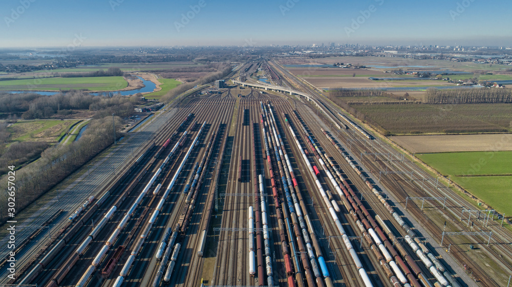 Cargo trains close-up. Aerial view of colorful freight trains on the ...