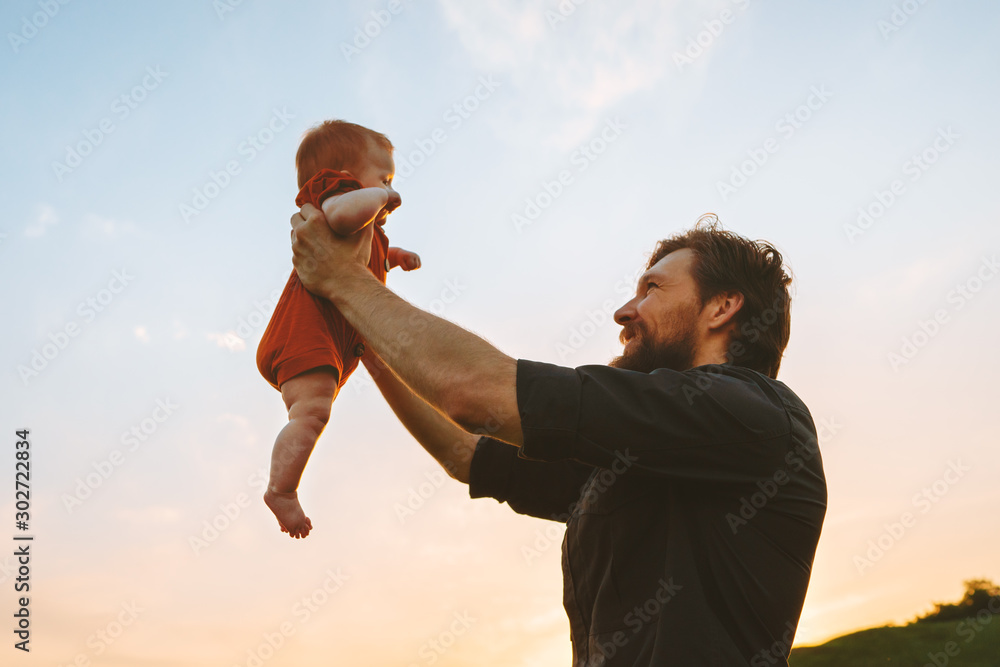 Happy father hands holding infant baby outdoor joyful family moments ...