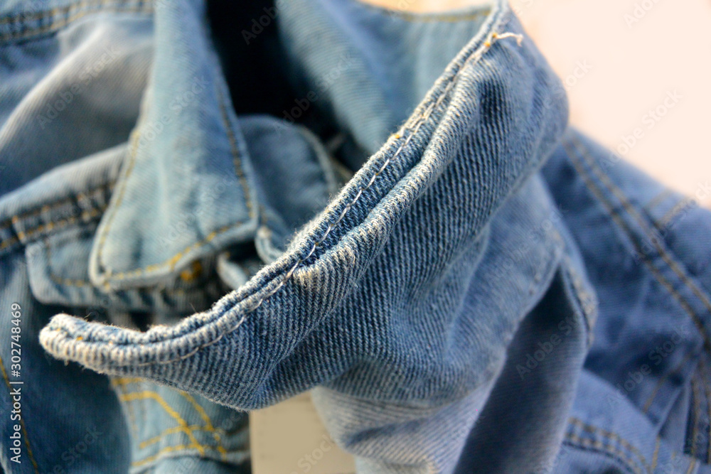 Poor seam quality on a denim jacket. Bad work Stock Photo | Adobe Stock