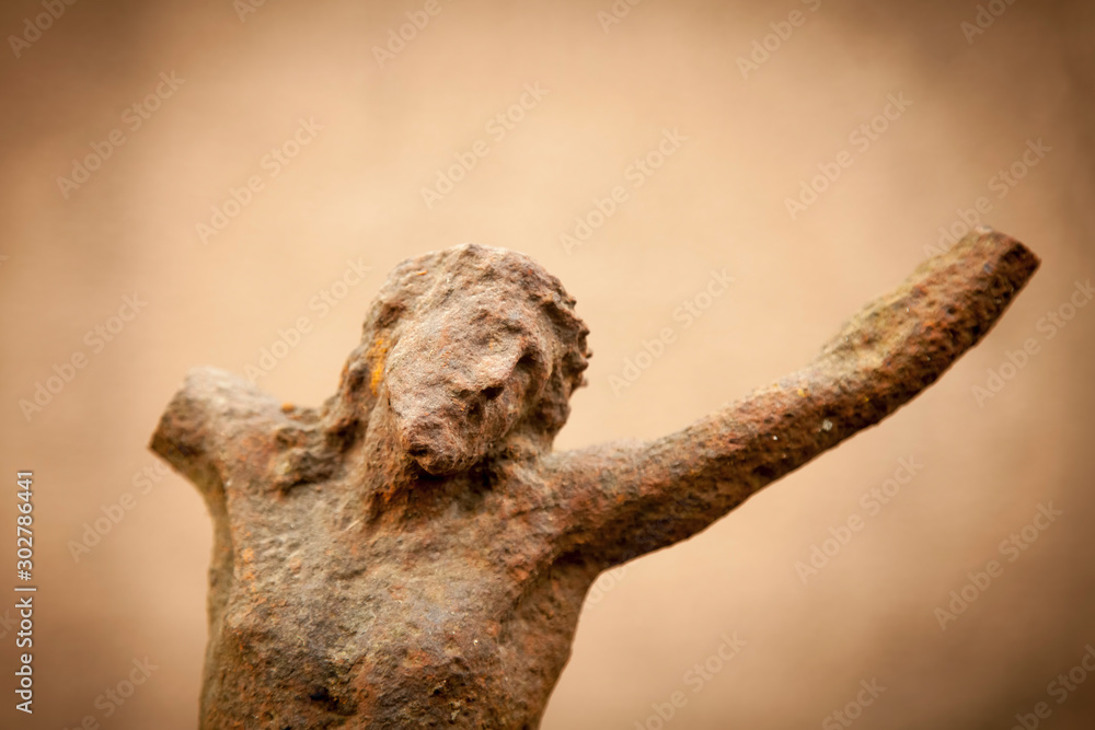 Destroyed ancient iron statue of crucifixion of Jesus Christ as a ...