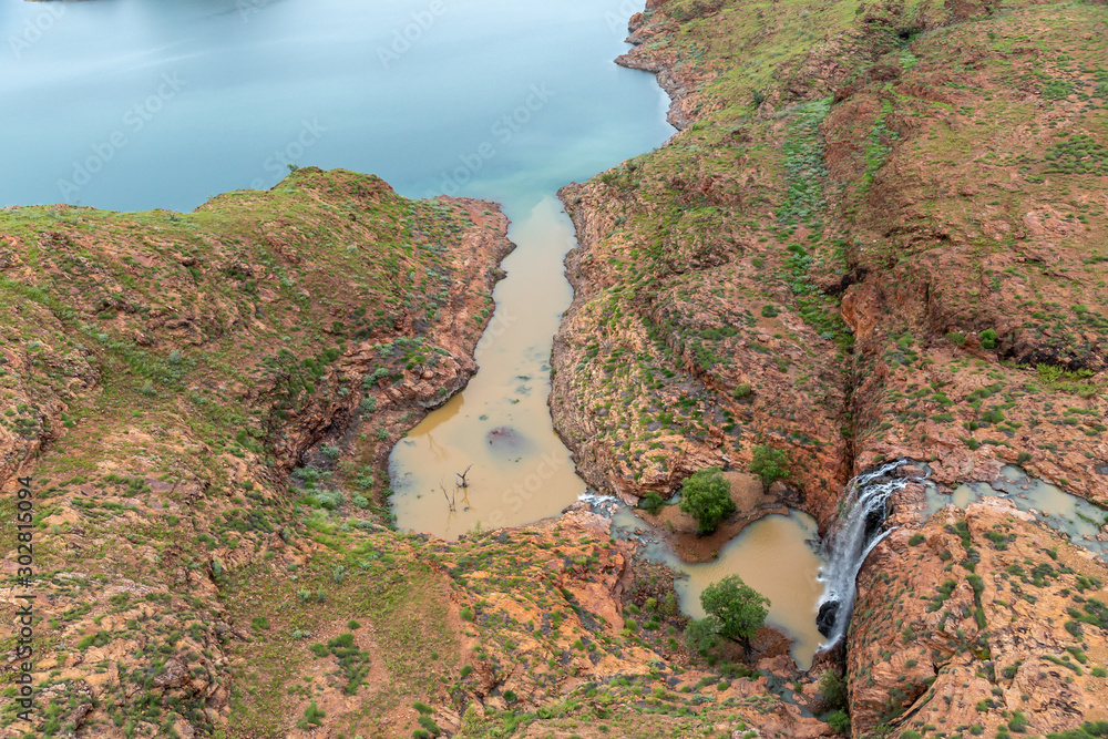 Aerial landscape view of Home Creek waterfall where it enters Lake Argyle, the largest man made ...