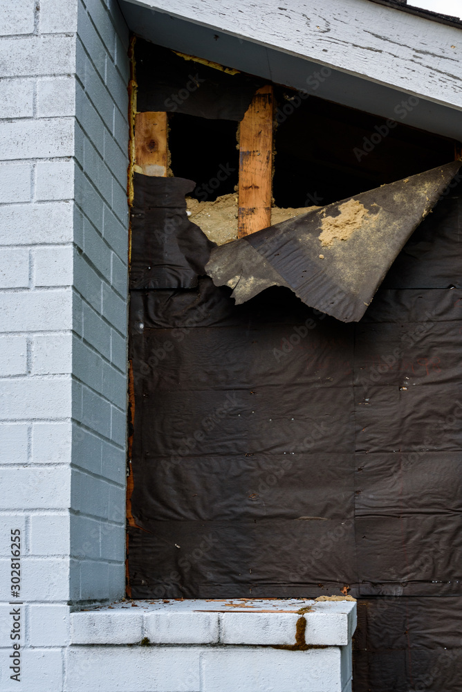 Siding project, outside of house with old siding removed, black ...