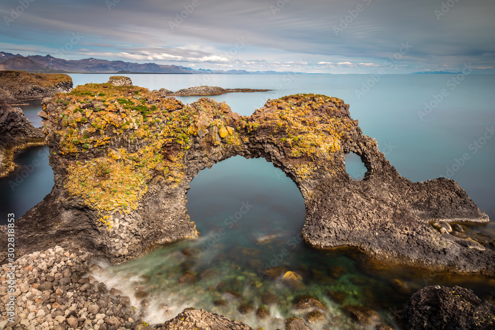 Iceland's Famous basalt Stone Arch Gatklettur in Western coastal sea ...