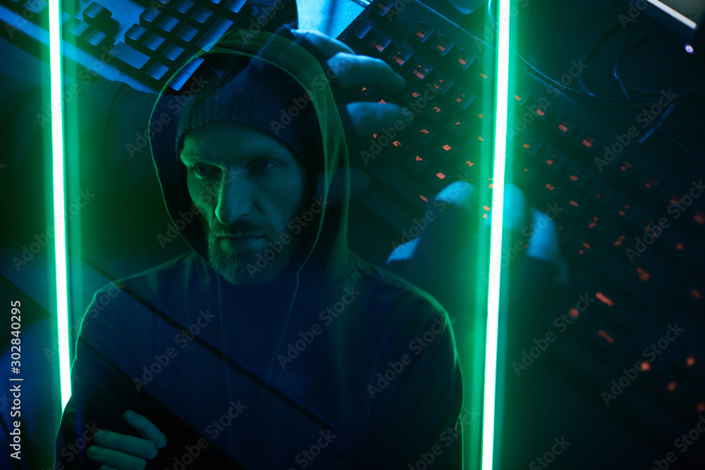 Computer hacker standing and remembering the password from computer ...