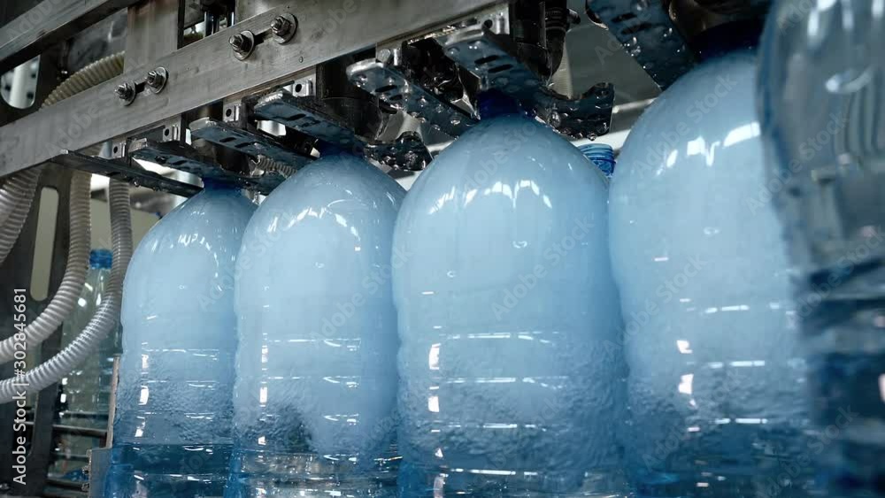 Production of artesian water from natural well in plastic bottle ...