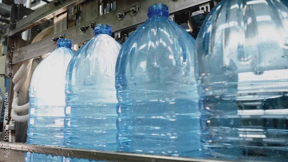 Process of production drinking fresh water on automatic conveyor line ...