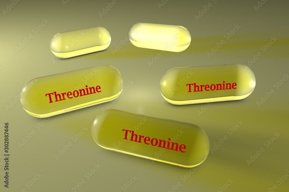 Yellow threonine capsules. Threonine is an essential amino acid used in ...