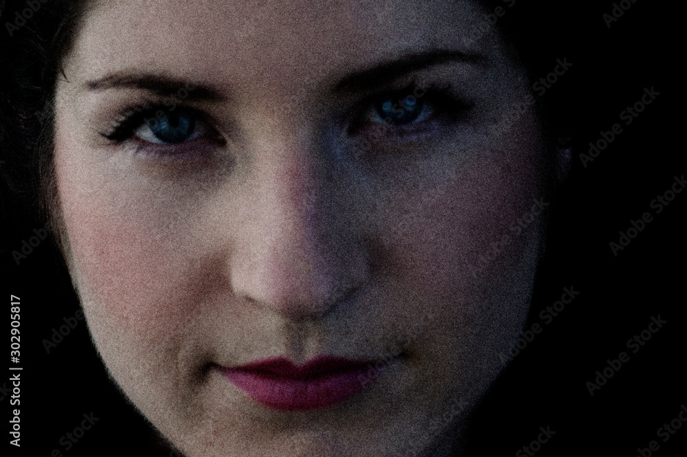 Mysterious extreme close-up of a woman's face. Grainy image style ...