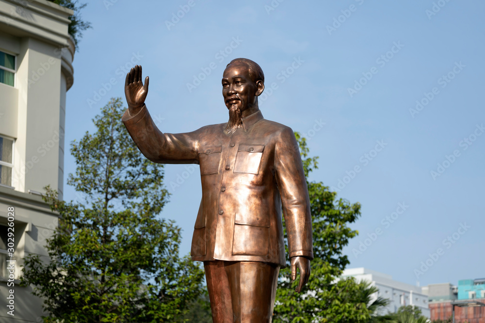 Recently polished bronze statue of Ho Chi Minh standing in the famous ...