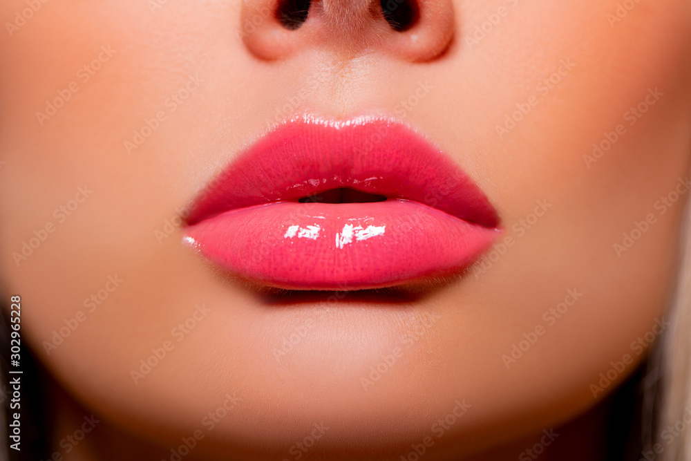 lips with pink lipstick. Gorgeous blonde model with perfect makeup to ...