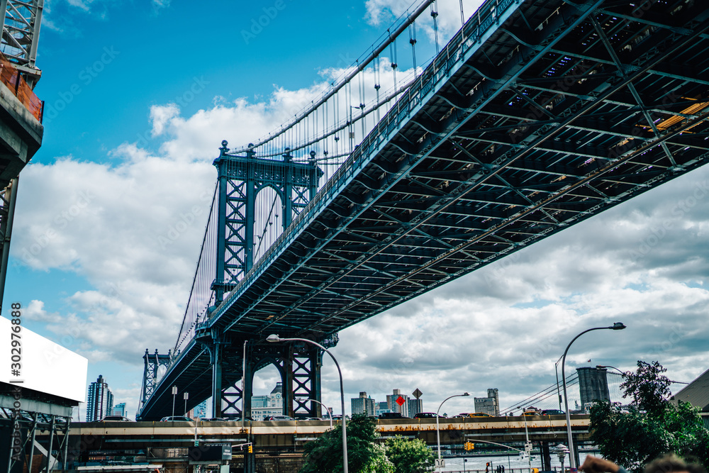 Famous suspension blue metal bridge for city infrastructure connecting ...