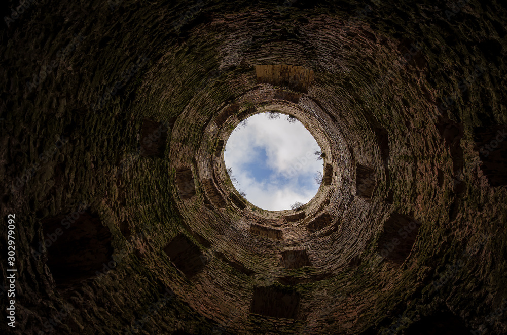 View up inside an old round fortress tower. Visible medieval brickwork ...