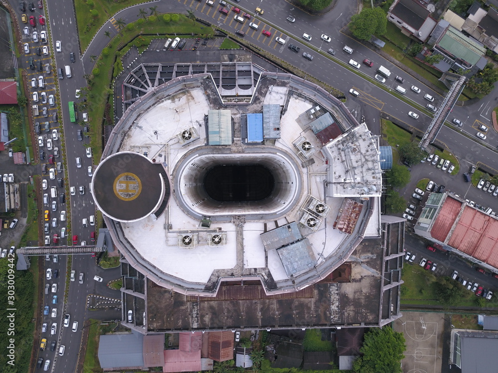 Creative shot - an aerial top down view of a donut shaped building in ...