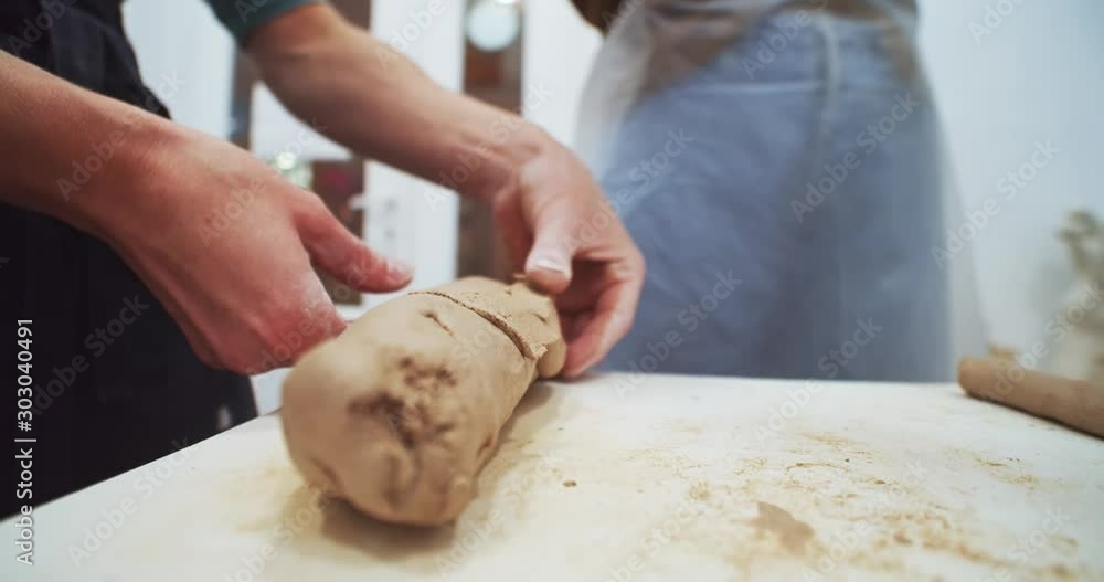 Clay craft modeling lessons. Two girls show how to apply material by ...