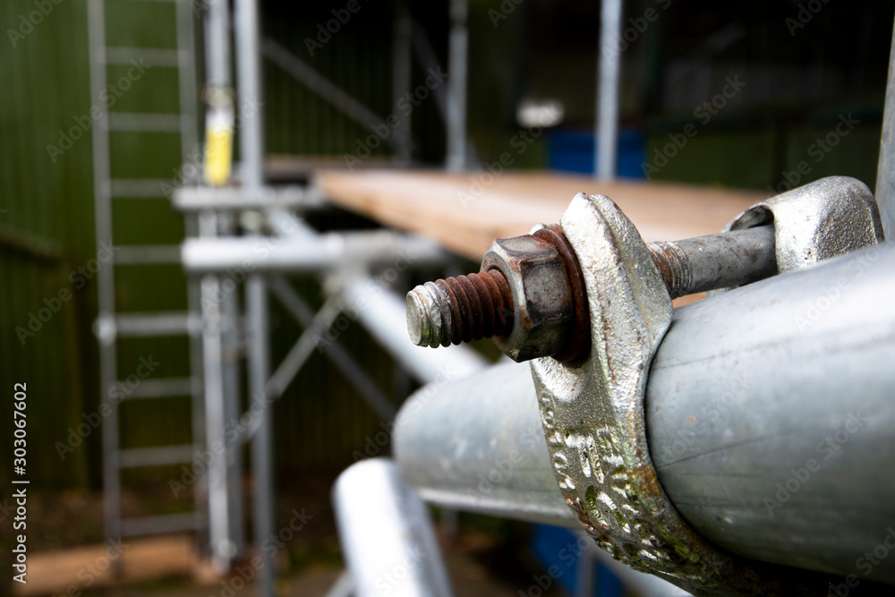 Galvanised steel scaffolding coupling connection on construction site ...