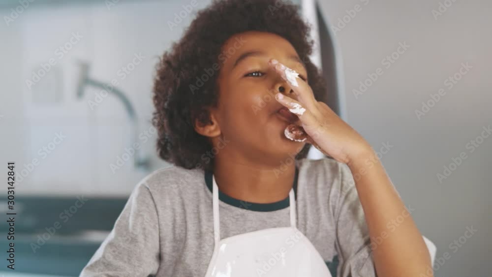 Video „Young family cooking food in kitchen. Happy Little girl with her ...