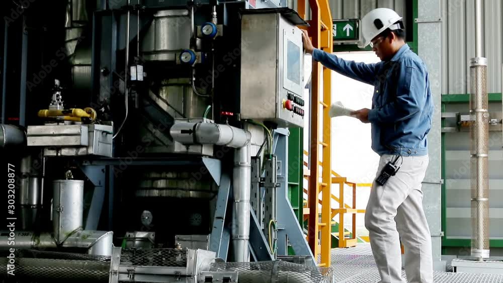 Safety first concept. A worker wearing a safety helmet, safety shoe and ...
