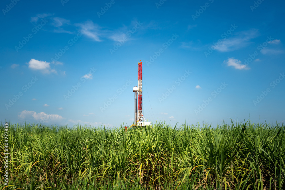 Drilling rig in oil field industrial is operating in rural location ...