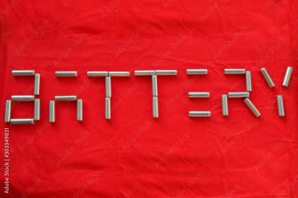 Inscription Battery made of lithium ion batteries on red background ...